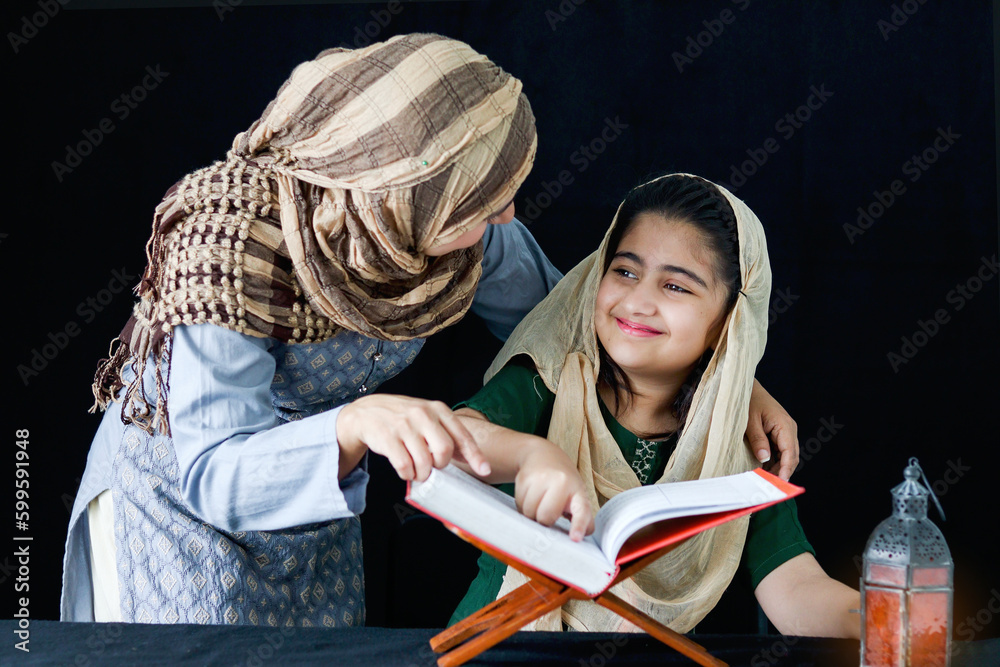 Adorable Pakistani girl with beautiful eyes wear hijab, learning Quran ...