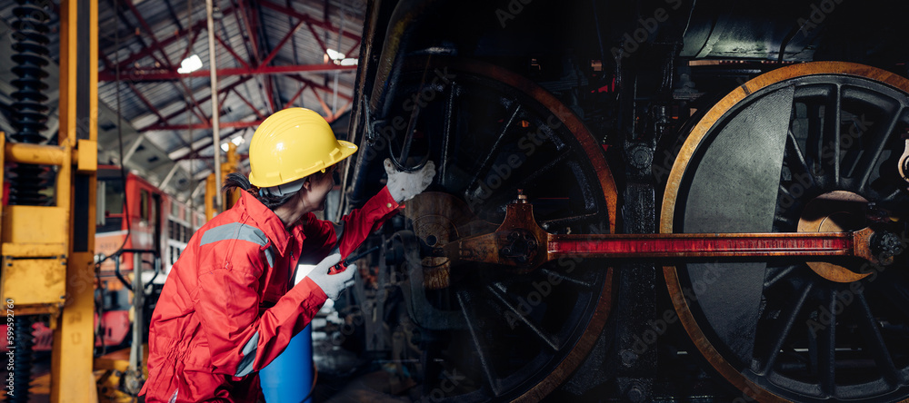 Engineer railway wearing safety uniform and helmet under checking under ...