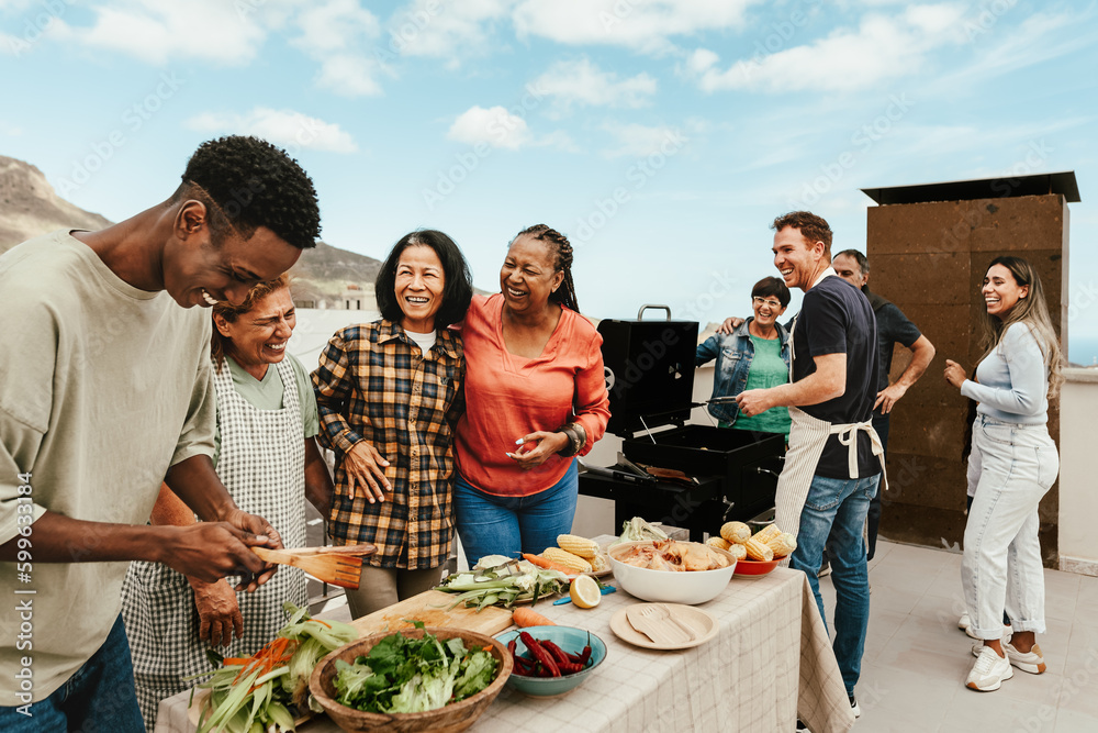 Happy multigenerational people having fun doing barbecue grill at house ...