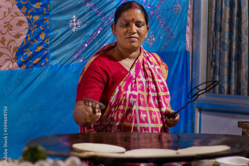 Cook of a local roadside restaurant, making bread or a roti, Local ...
