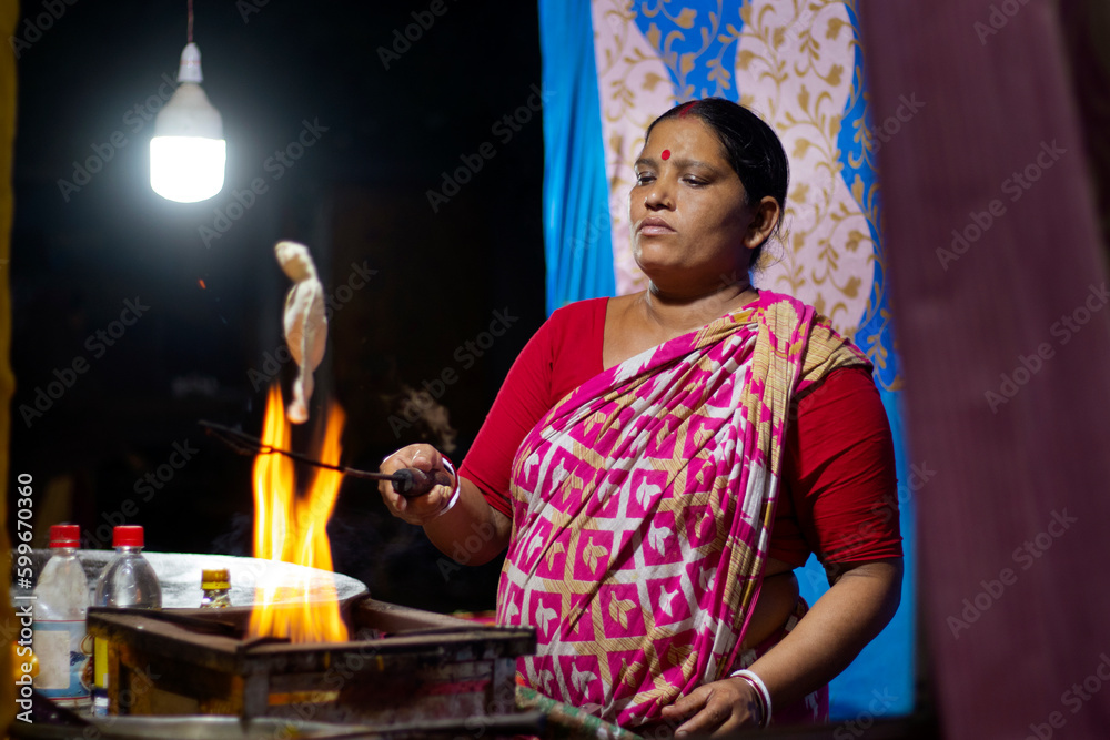 Cook of a local roadside restaurant, making bread or a roti, Local ...
