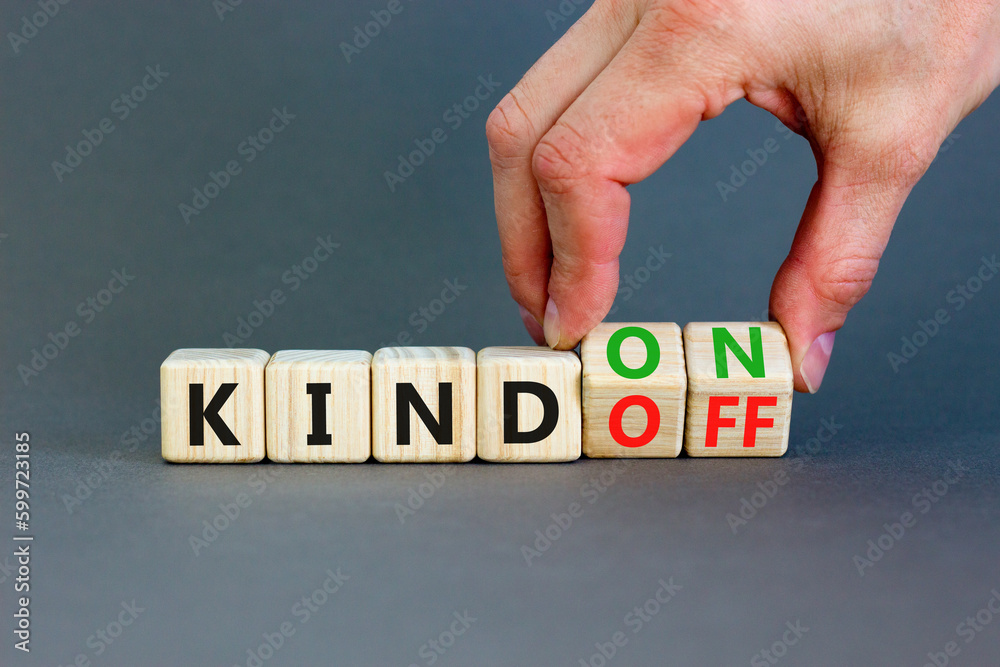 Kind on or off symbol. Businessman turns wooden cubes and changes word ...