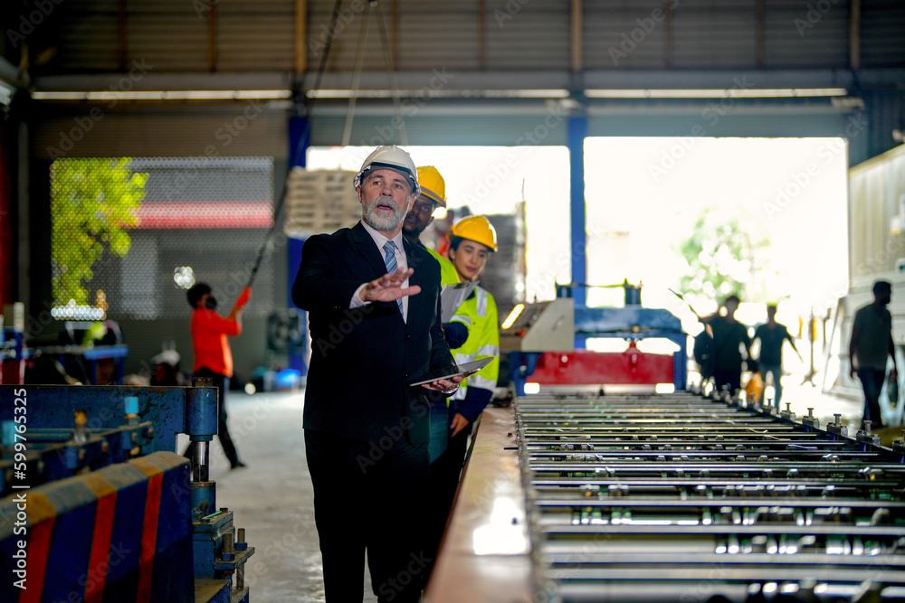 Senior boss manager inspecting with staff engineers woman and African ...