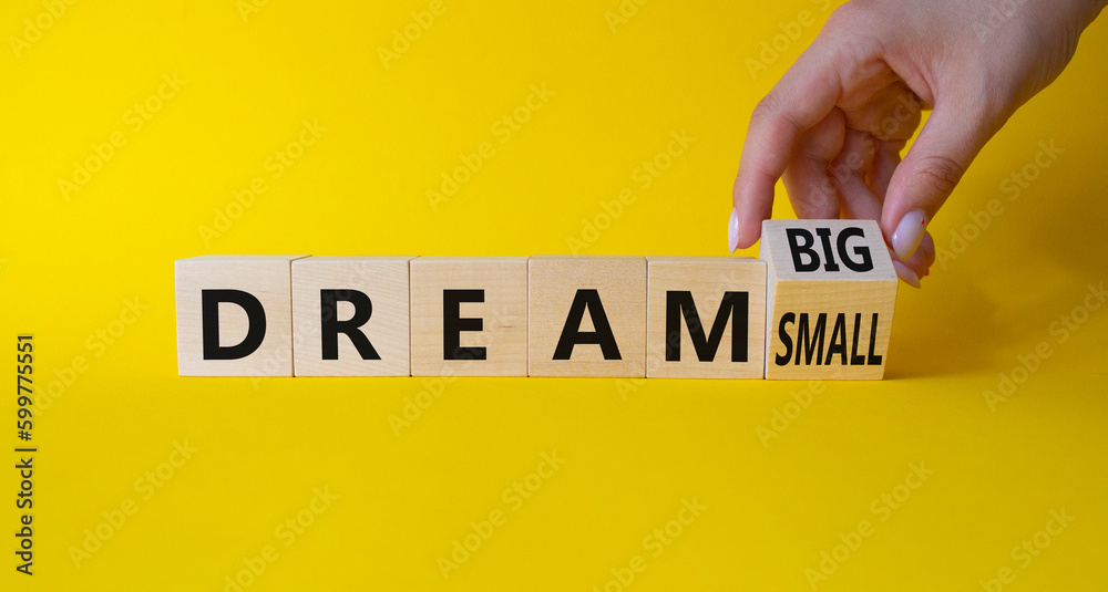 Dream Big vs Small symbol. Businessman Hand turns cubes and changes ...