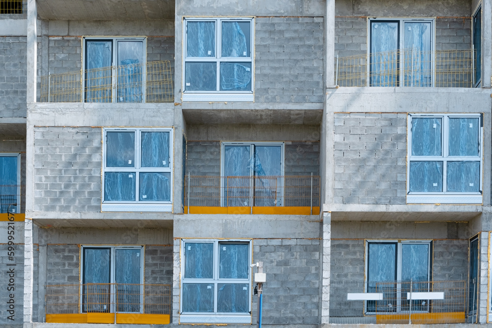 Windows installing on new Building, work on the construction site in ...