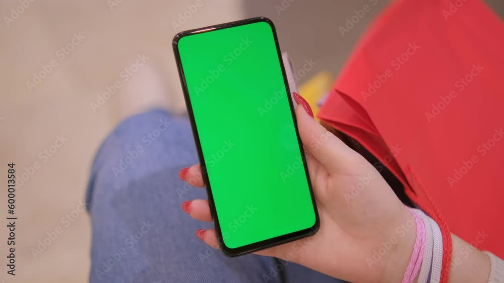 Woman with Green Screen Chroma Key Smartphone in mall. Woman Person ...