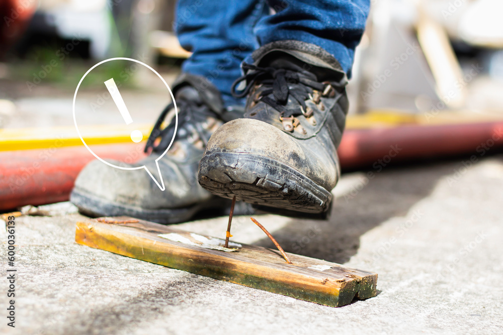 Wear safety shoes to ensure safety at work. construction workers wear ...