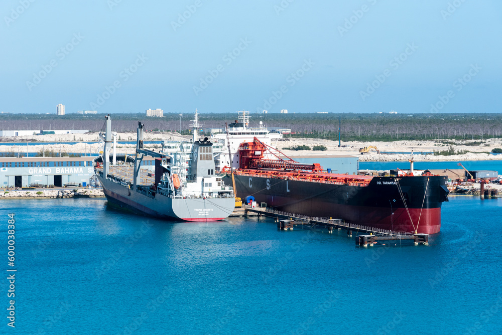Freeport, Bahamas - cargo ships berthed in the sea port. Stock Photo ...