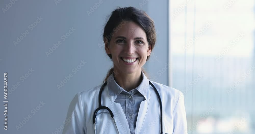 Head shot of happy successful Latina woman general practitioner or ...