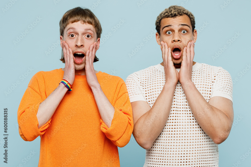 Young shocked surprised sad couple two gay men wearing casual clothes ...