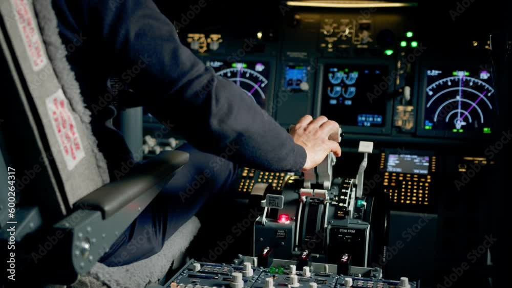 pilot pressing the gas pedal in the cockpit of a jet plane during a ...