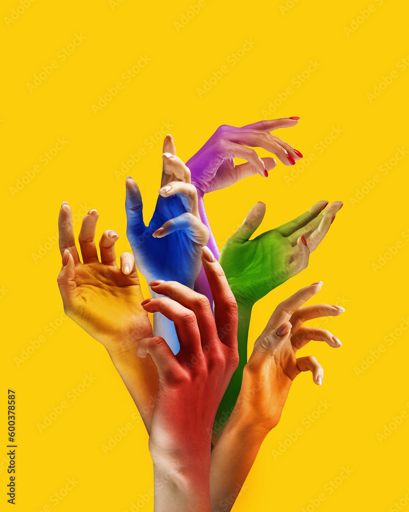Female hands with rainbow colors over vivid yellow background. Human ...