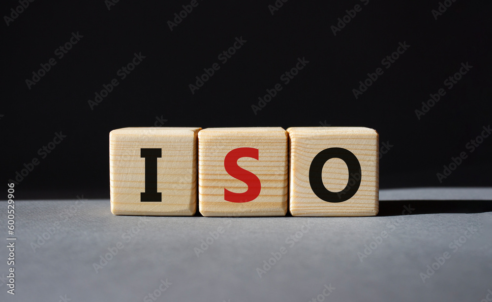 ISO standards quality control symbol. Concept word ISO on wooden cubes ...
