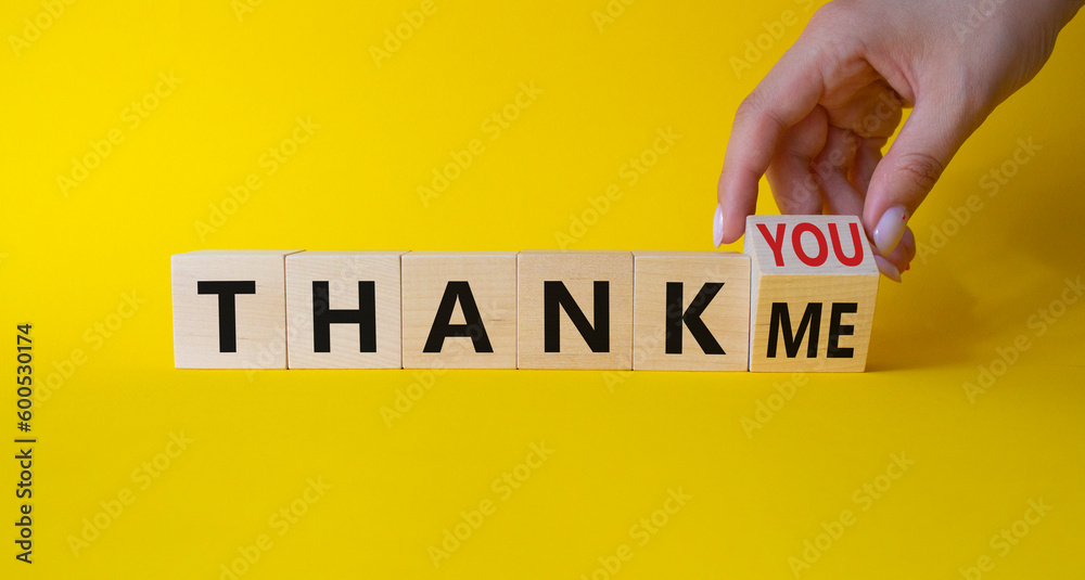 Thank You or Me symbol. Businessman Hand turns cubes and changes words ...