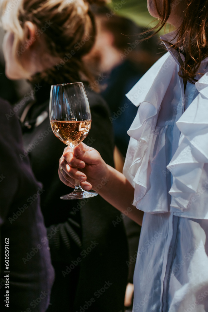 People hands holding glass of champagne at the party, glass of prosecco ...