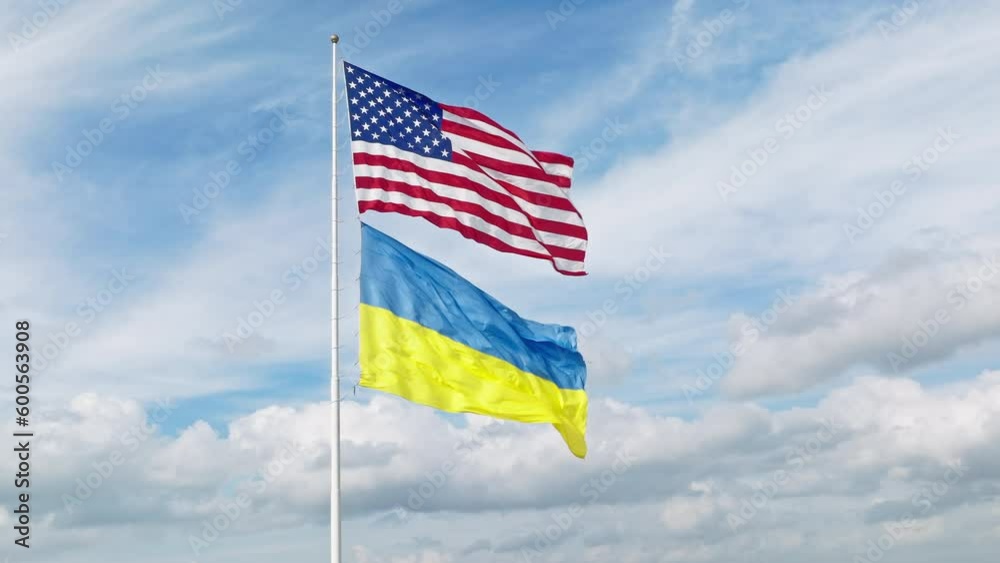 Epic slow motion background with flags of USA and Ukraine flattering at ...