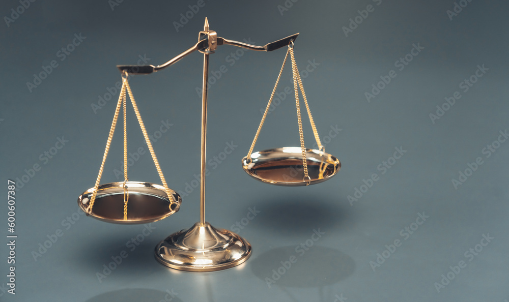 Shiny golden balanced scale in courtroom background as concept justice ...