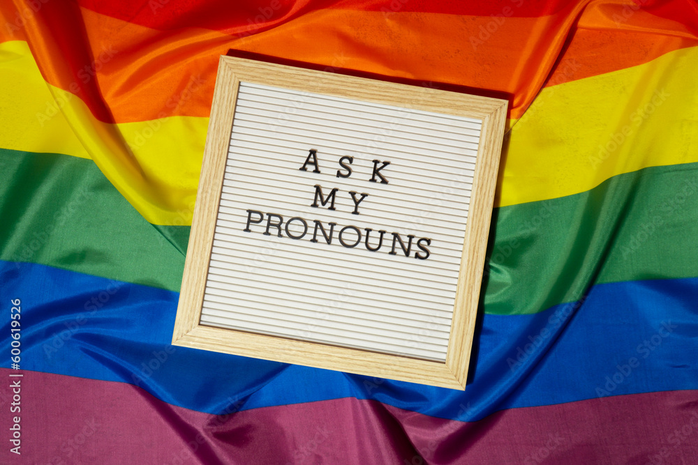 ASK MY PRONOUNS text Neo pronouns concept on Rainbow flag background ...