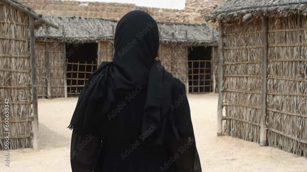 Arabic woman in hijab headscarf on head in poor islamic bedouin village ...