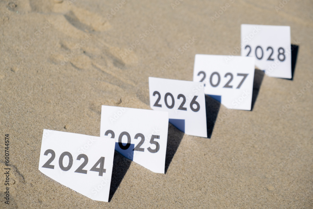 Paper cards with numbers of years from 2024 to 2028 in a row. New year ...