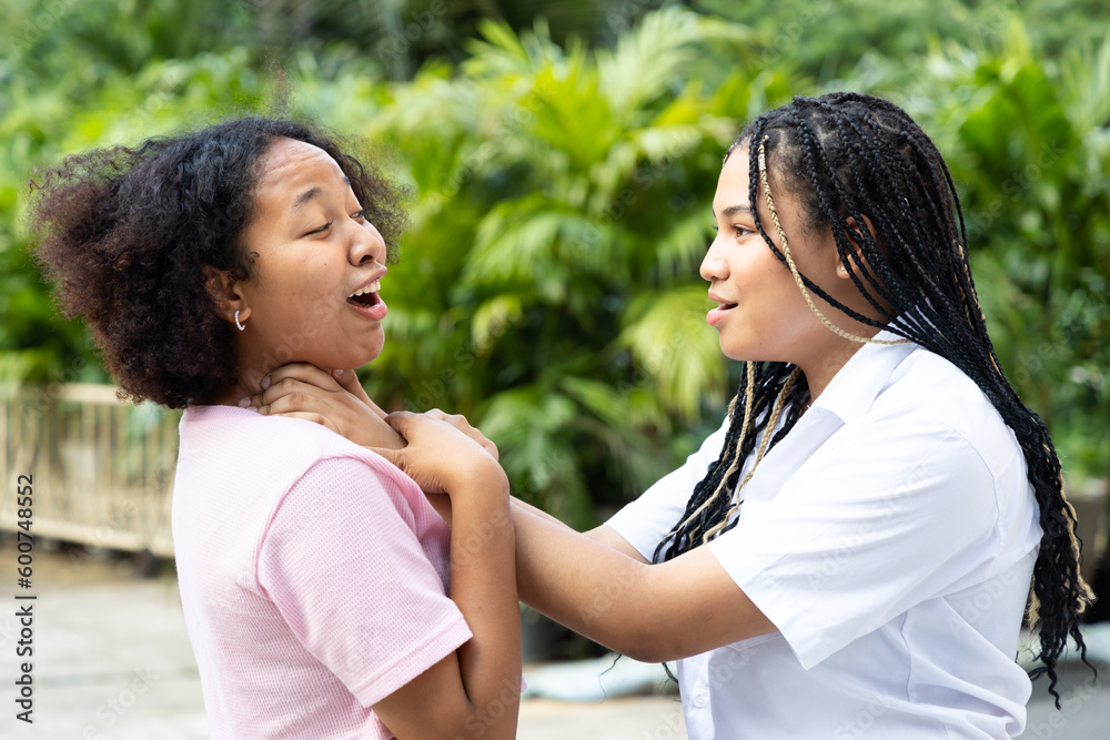 Poster Angry African woman strangle her friend, concept of physical ...