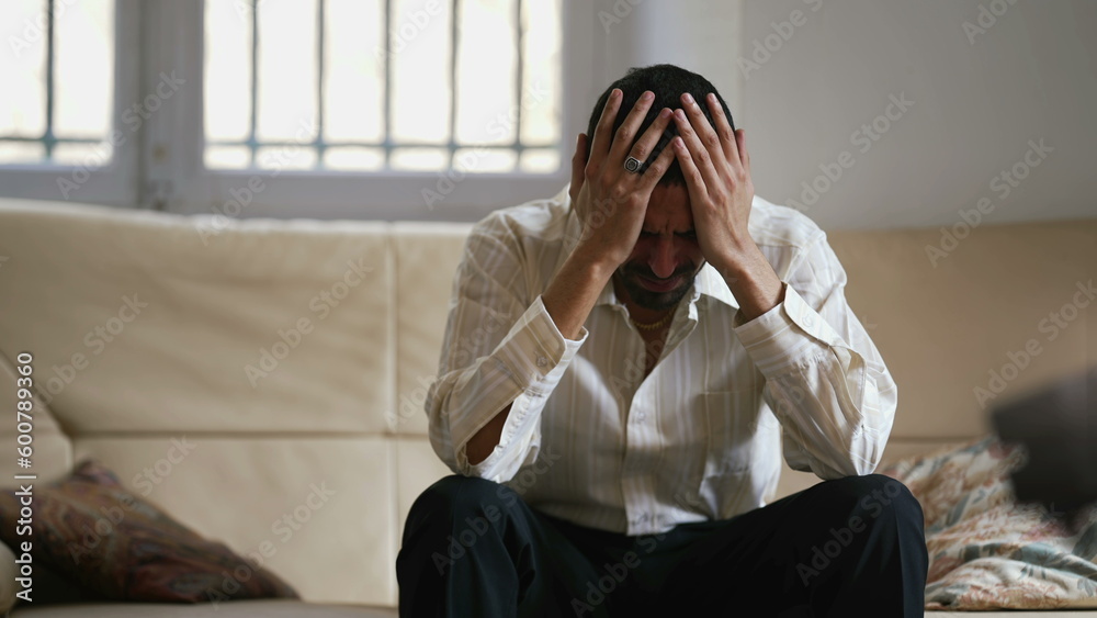 Dramatic young man feeling distraught and stressed from emotional ...