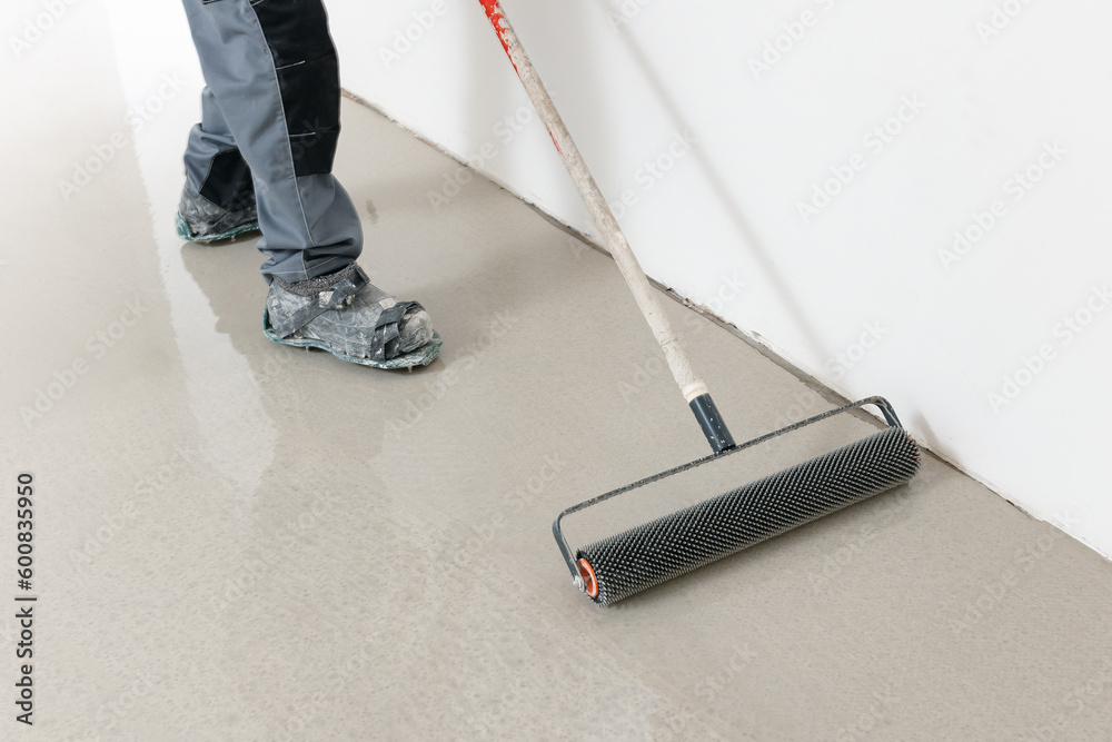 Master with needle roller for new screed concrete with mixture of ...