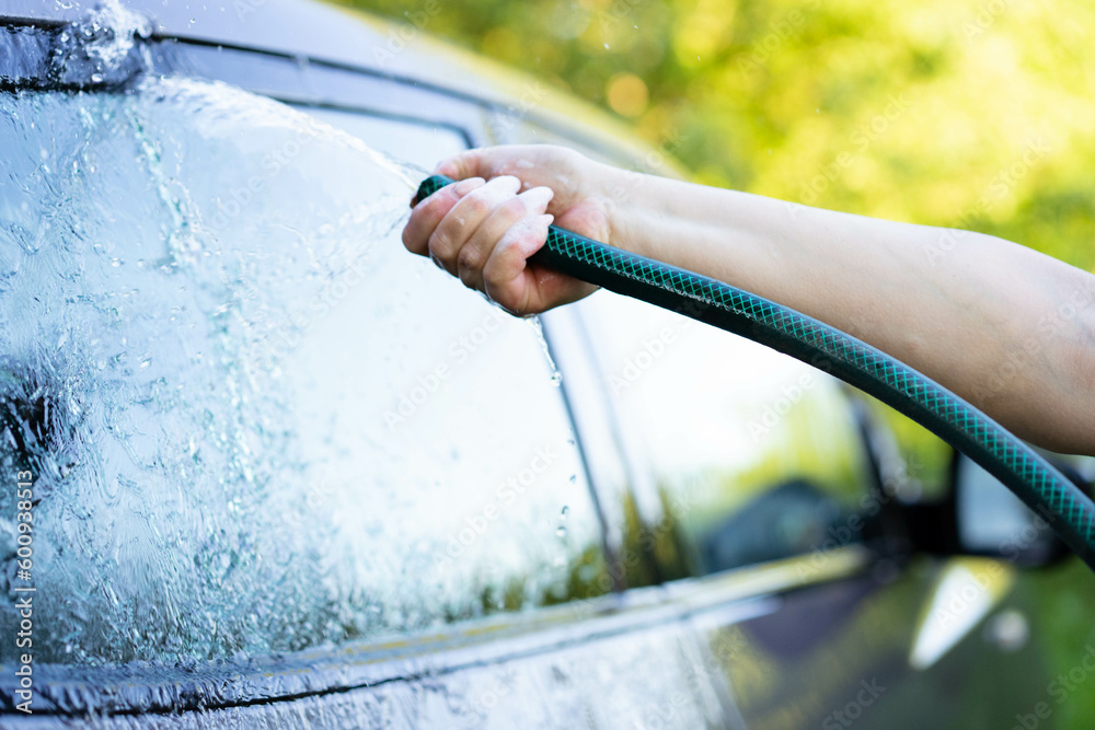 car wash, car care, summer car wash. Cleaning the car using water Stock ...