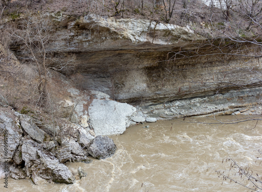 Foto de Mountain river , spring flood with rising water levels due to ...