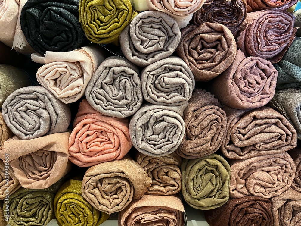 Colorful pile of hijab roll in a hijab store for fashion and styling ...