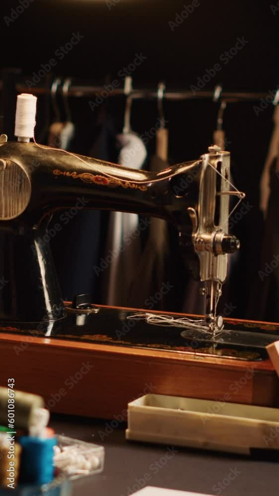 Vertical video Old school sewing machine in atelier, fashion industry ...