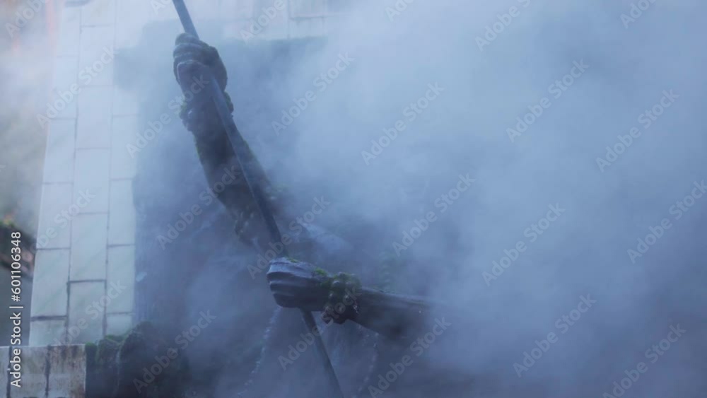 Shiva statue covered by hot water vapors of the natural hot water ...