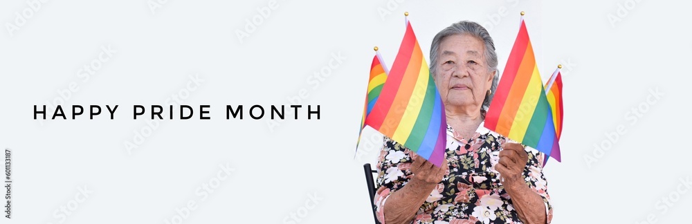 Asian senior woman holding rainbow flags with texts 'Happy Pride Month ...