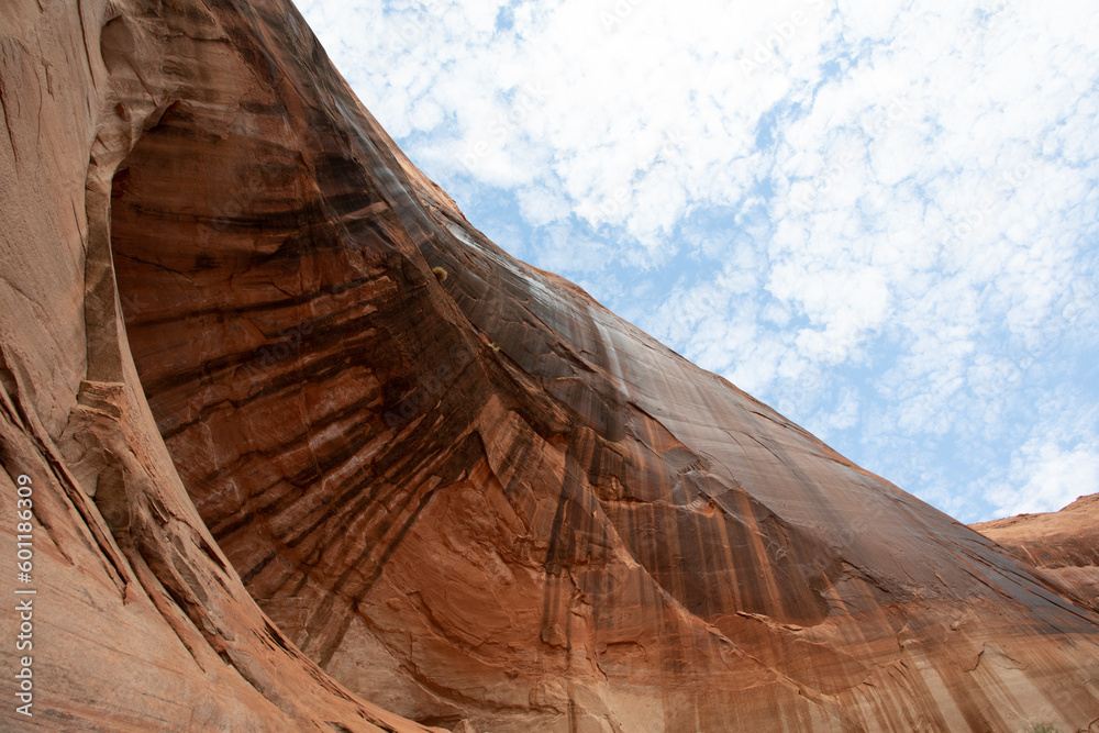 red rock texture with cracks, skies, water, background with space for ...