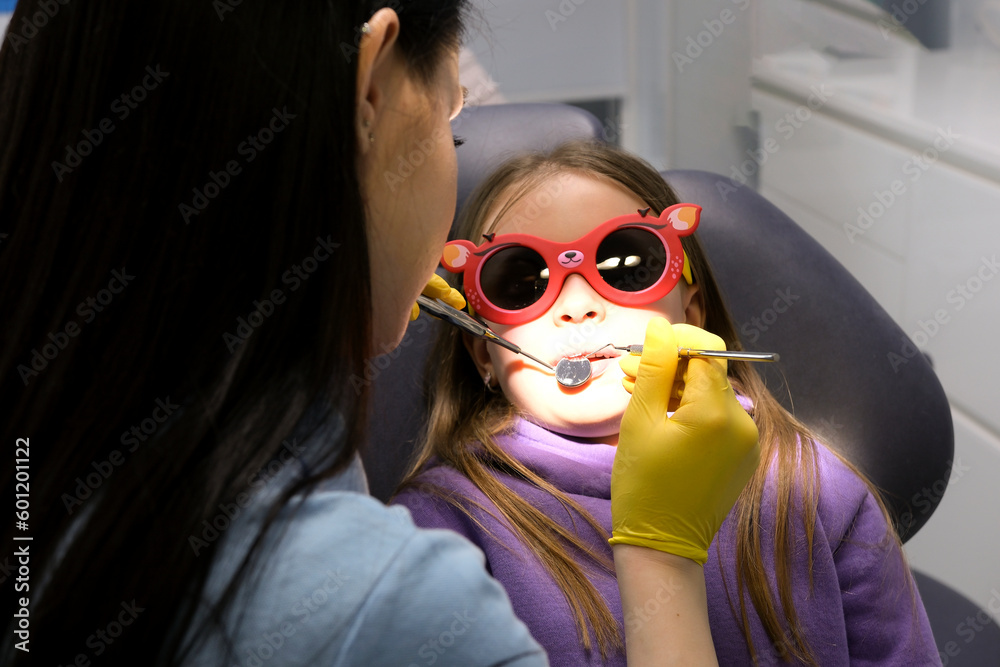 pediatric dentistry close-up little girl opened mouth shows teeth ...