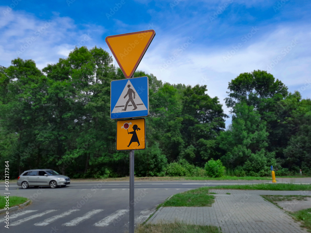 Road signs in front of pedestrian crossing near school. Warning Road ...