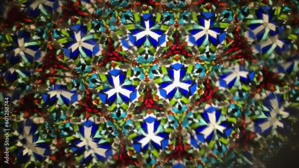 Slow motion inside a real kaleidoscope. Unusual patterns smoothly ...