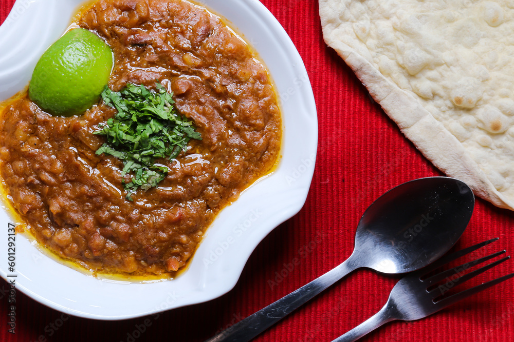 Foul mashes fava beans with lemon and bread served in dish isolated on ...
