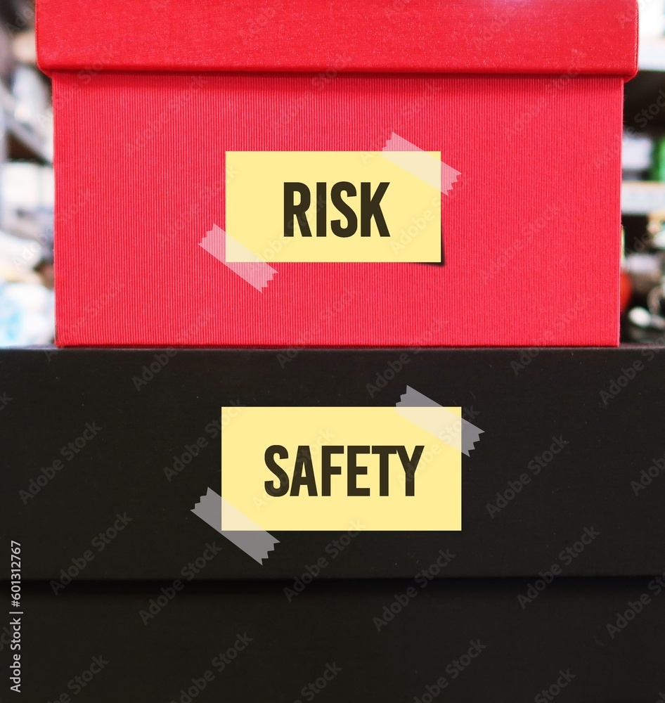Red and black boxes with note label SAFETY and RISK, concept of ...