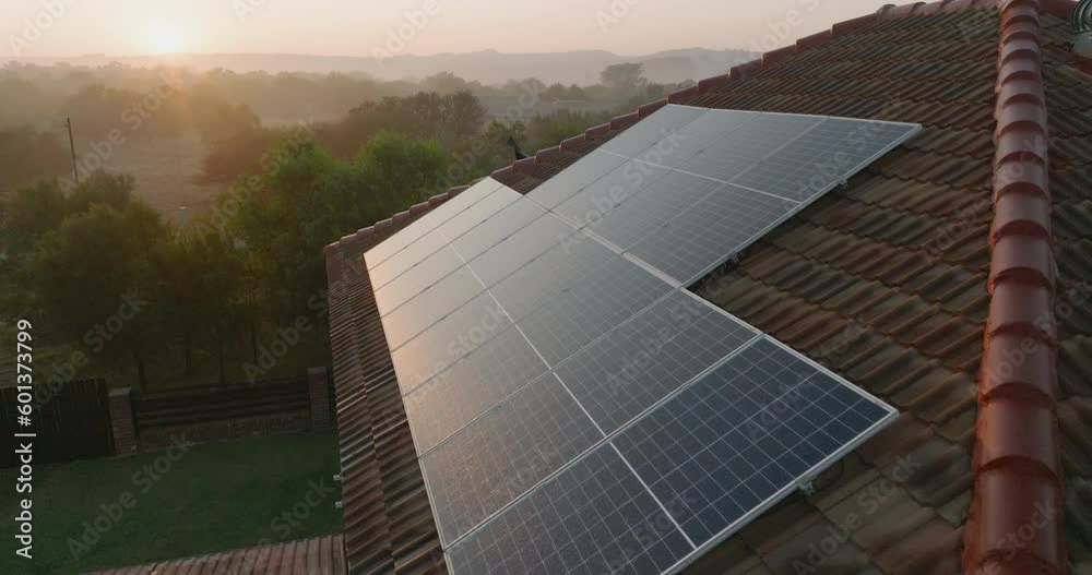 Aerial view of sunlight catching the photovoltaic solar panels on a ...