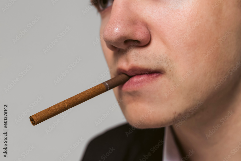 Portrait of a young mafia member with a slicked back hair, dressed in ...