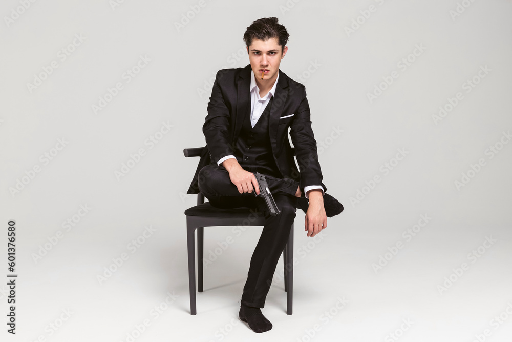 Important, authoritative Young mafia member with a slicked back hair ...