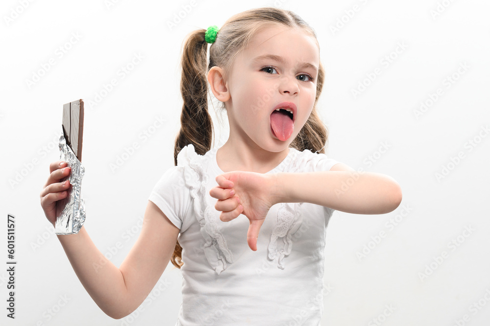 Child pointing down to chocolate, portrait of little girl with ...