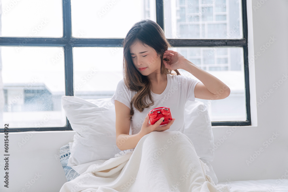 Healthy asian woman waking up relax muscles beside window early morning ...
