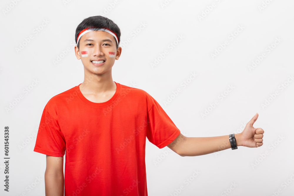 Young Indonesian man smiling doing thumbs up celebrate Indonesia ...