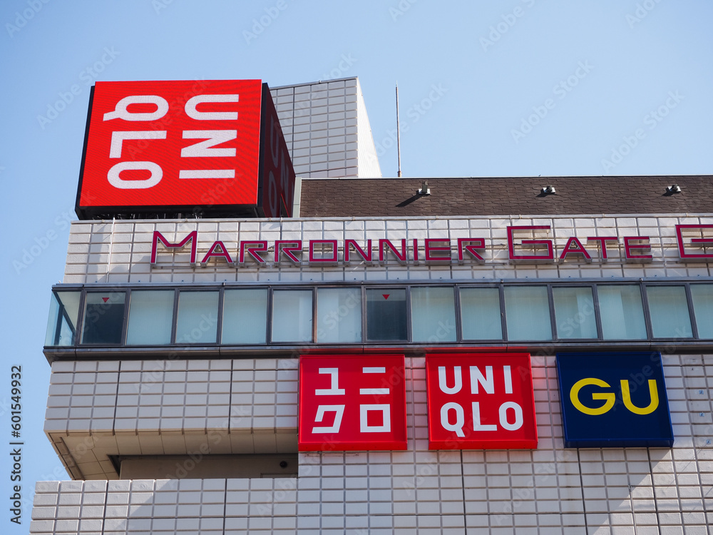 TOKYO, JAPAN - March 19, 2023: Uniqlo and GU signs on Marronnier Gate ...