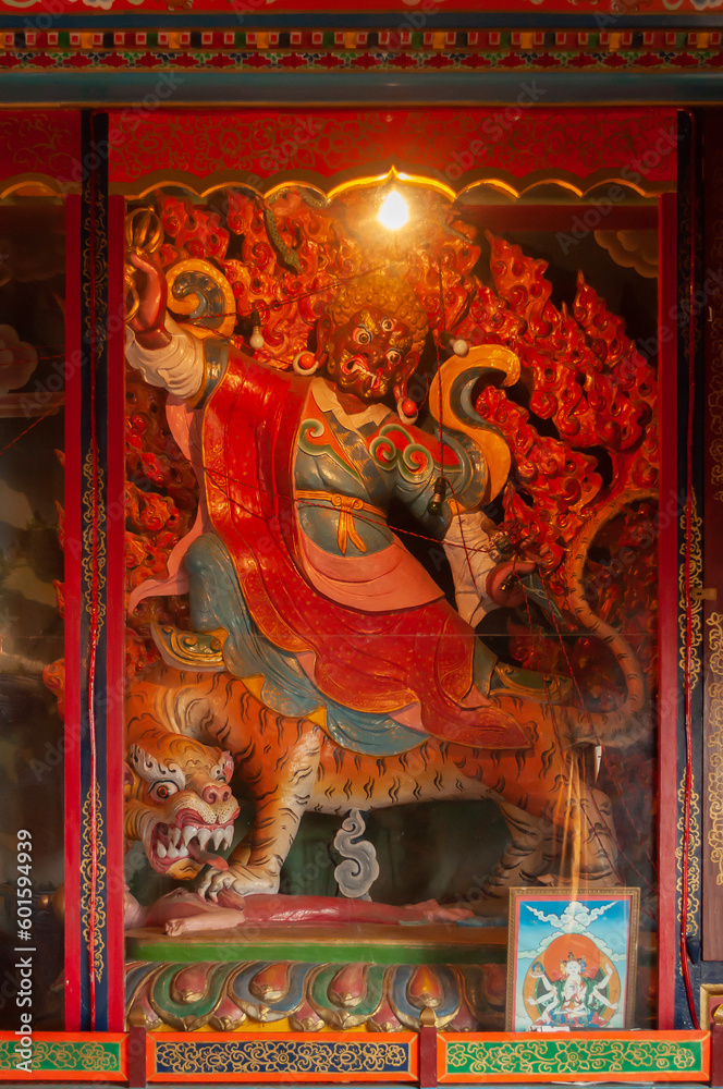 Sikkim, India - 22nd March 2004 : Glass covered colorful Buddist Gods ...