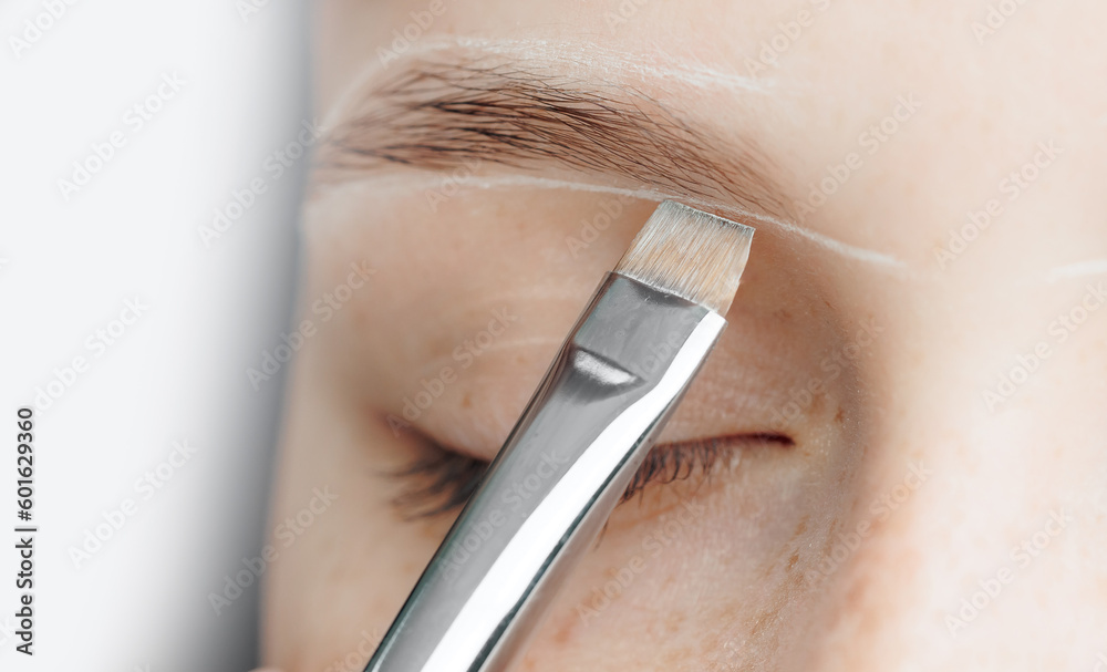 Brow correction, Master tweezers depilation of eyebrow hair in women ...