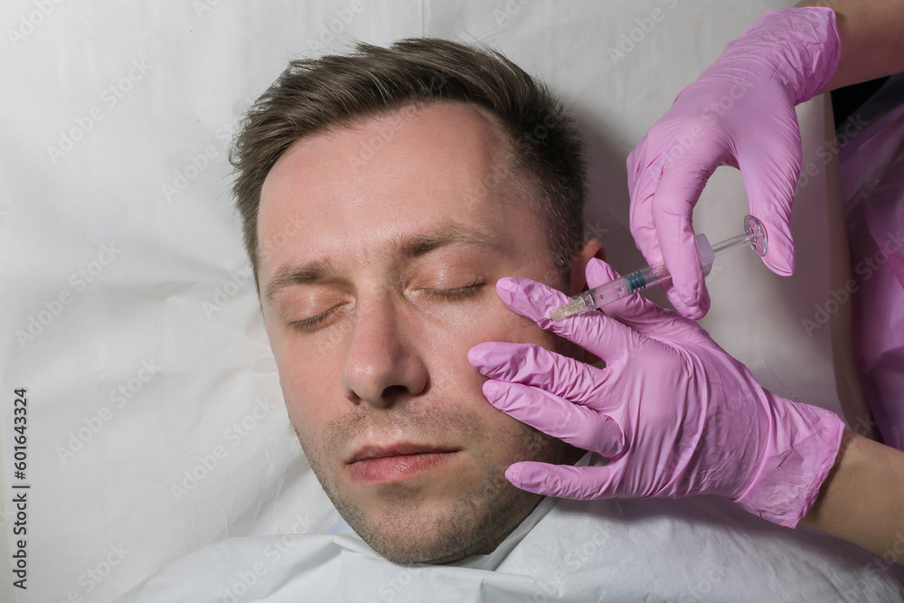 An Anonymous Female Beautician Giving Male Patient Botox Injection In ...