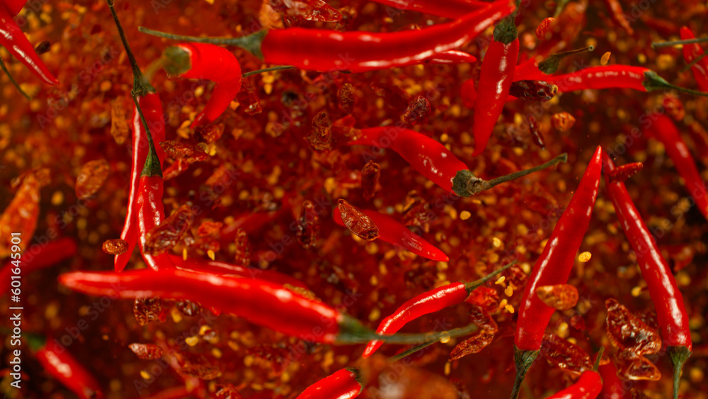 Chilli peppers flying up in the air. Freeze motion. Isolated on black ...